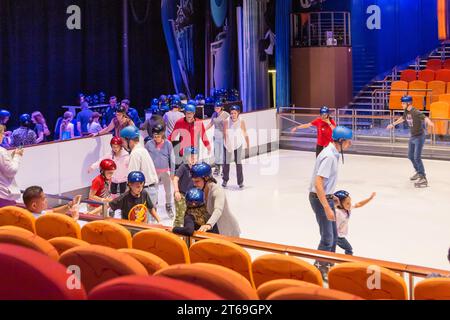 Cruise passengers skating at the onboard ice skating rink on the Royal ...