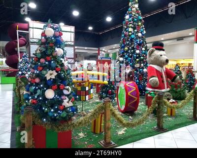 Beautiful ceramic Christmas trees and balls on color background Stock ...