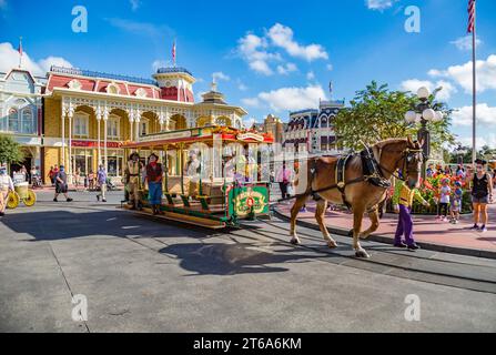 Horse pulling trolley car with Disney characters down Main Street in ...