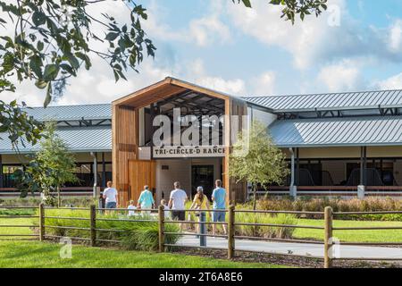 Family entering the Tri-Circle-D Ranch horse stables in the Fort ...