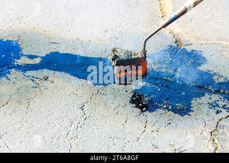 Bitumen emulsion joint seal restorer is used to repair cracks in ...