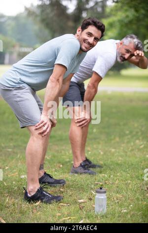 two runners standing talking after running Stock Photo - Alamy
