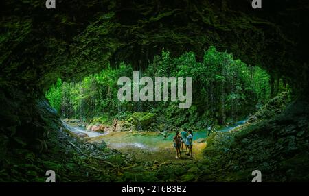 A cavern near the river where people relax Stock Photo - Alamy