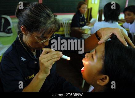 USNS Mercy Sailors help children Stock Photo - Alamy