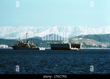 USS Brunswick (ATS-3) towing the Adept (AFDL23) - 1 Stock Photo - Alamy