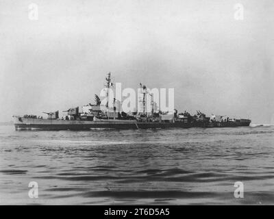 The USS Charles P. Cecil (DD-835), a destroyer, is underway conducting ...