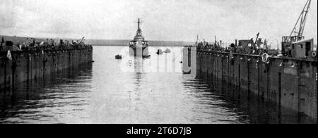 USS Columbia (CL-56) entering floating drydock 1944 Stock Photo - Alamy
