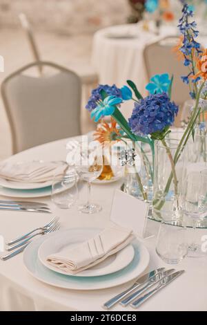 Glasses of water on table and colorful background Stock Photo - Alamy