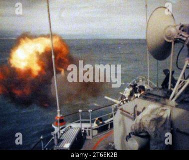 USS Mansfield (DD-728) fires 5-inch guns off the coast of North Vietnam ...