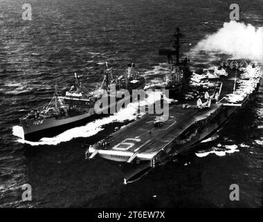 USS Navasota (AO-106) refuels USS Oriskany (CVA-34) and USS King (DLG ...
