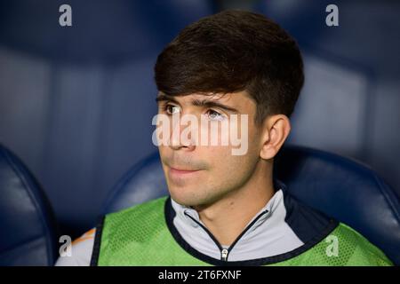 Pablo Marin of Real Sociedad competes for the ball with Juan Cruz of CD ...