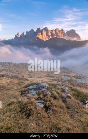 Italy, Veneto, Belluno district, Falcade, autumn sunset with low fog ...