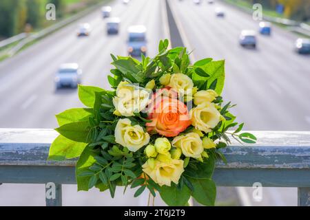 Bouquet of flowers on a highway bridge Stock Photo - Alamy