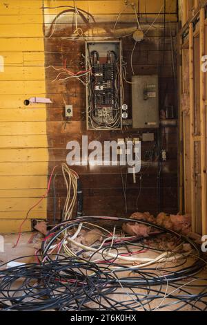 Old electricity distribution panels and cables in abandoned commercial ...