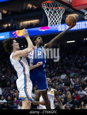 Oklahoma City Thunder guard Josh Giddey, left, goes up for a shot as Minnesota Timberwolves ...