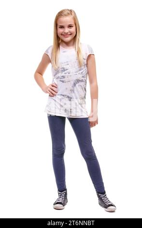 preteen girl in trendy outfit and sunglasses using smartphone isolated ...