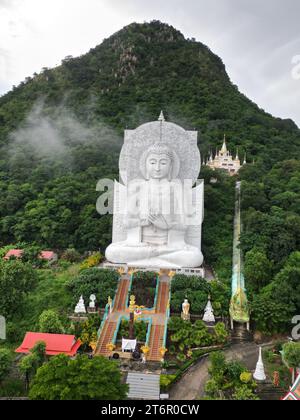 Buddha statue in the posture of giving the first sermon Or the ...