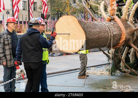 Workers install spike into The Rockefeller Center Christmas Tree on the ...