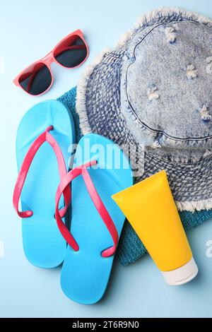 Flat lay composition with sunscreen and different beach accessories on ...