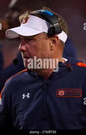 Auburn head coach Hugh Freeze greets fans as he walks to the stadium in ...
