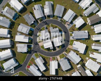 A mobile home neighborhood is shown from an aerial, daytime view among ...
