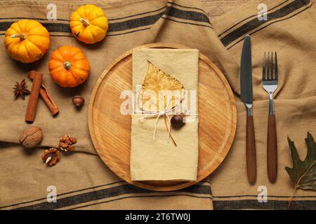 Stylish autumn table setting on color fabric background Stock Photo - Alamy