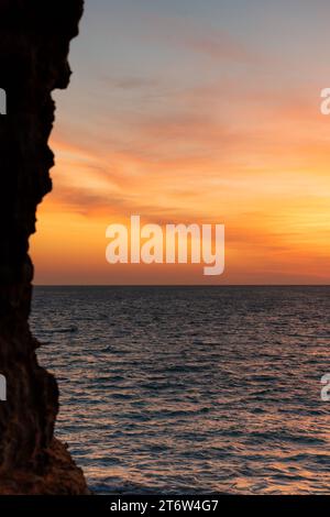 The view from a cliffside over the ocean waves, with the powerful waves ...