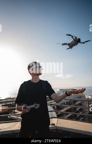 Drone Pilot Launching Drone from Hand at Sunset Stock Photo - Alamy