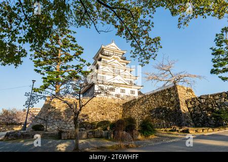 Fukuyama castle, Japan. Ishigaki stone walls, cherry blossom trees, the ...