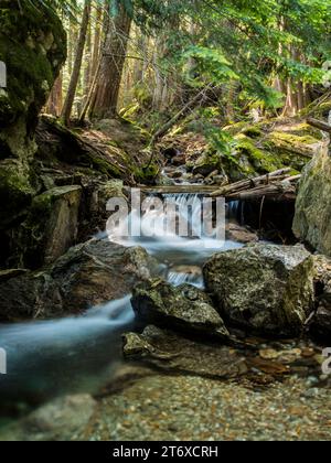 Small waterfall with motion blur suggesting peace and calm, happy creek ...