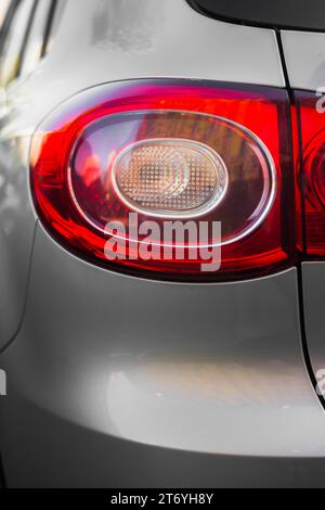 Rear view of silver SUV car on the misty mountain road. Exploration ...