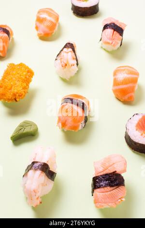 High angle view of delicious sushi served in trays with drinking ...