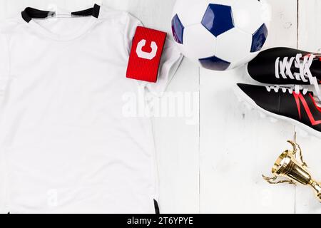 Composition of male american football player holding helmet at stadium ...