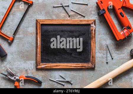 Elevated view blank slate various worktools Stock Photo - Alamy