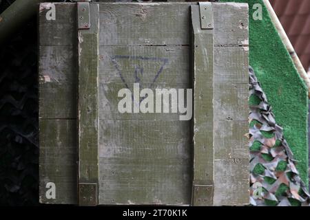 Soviet army ammunition stack of green crates with russian names of ammo ...