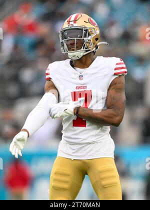 San Francisco 49ers cornerback Charvarius Ward, right, runs after ...