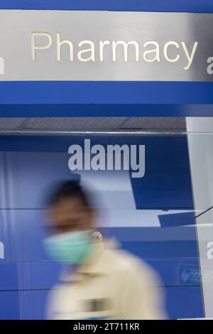 Pharmacy dispensing window with motion blurred people Stock Photo - Alamy