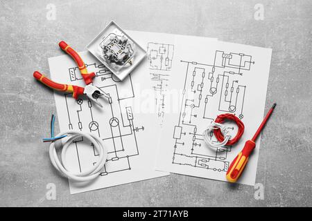 Wiring diagrams, wires and tools on grey table, flat lay Stock Photo ...