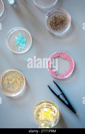 Set of Petri dishes with liquid samples on white background, top and ...