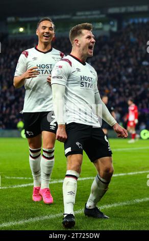 Derby County's Kane Wilson celebrates scoring their side's second goal ...