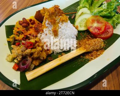 Nasi Campur Bali. Popular traditional Balinese dish of steamed rice ...