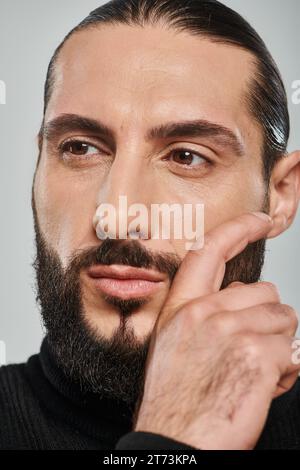 Close-up of confident, handsome middle-aged man with short gray ...