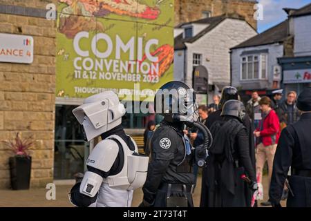 the Star Wars character Stormtrooper Pilot waves to children along the ...