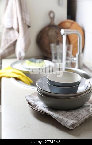 Clean bowls near kitchen sink. Washing dishes Stock Photo - Alamy