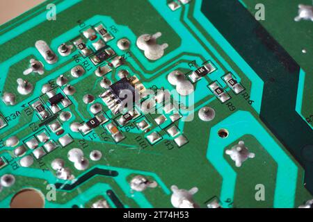 Damaged printed circuit board (PCB) with leaked electrolytic capacitor ...