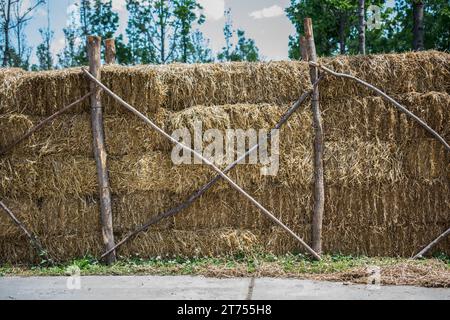 Hay bales stacks outdoors Stock Photo - Alamy