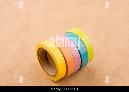 Color ribbon tapes on a wooden background Stock Photo - Alamy