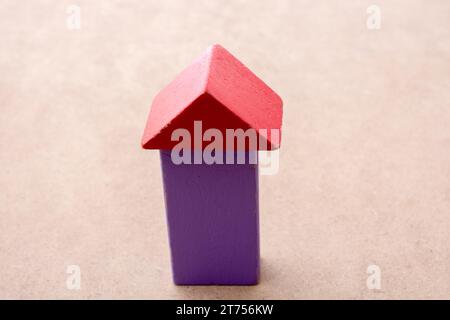 House shape formed out of building blocks on a brown background Stock ...