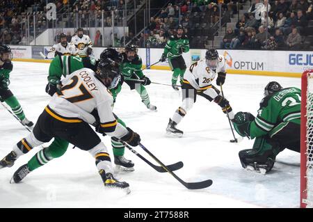 Noah Laba of Colorado College (26 in white) faces off against a North ...