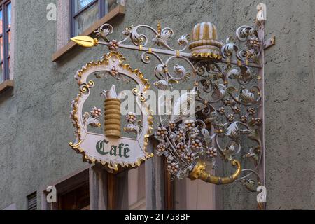 Wrought iron hanging sign for a cafe in the shape of an armadillo Stock ...